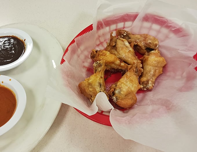 These wings aren't trying to be trendy with obscure flavors—they're just perfectly crispy messengers of joy served with dipping sauces.