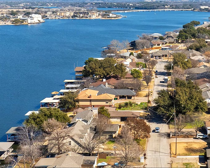 Lake Granbury creates a stunning blue backdrop for this waterfront community, where each home seems to have its own story and private dock.