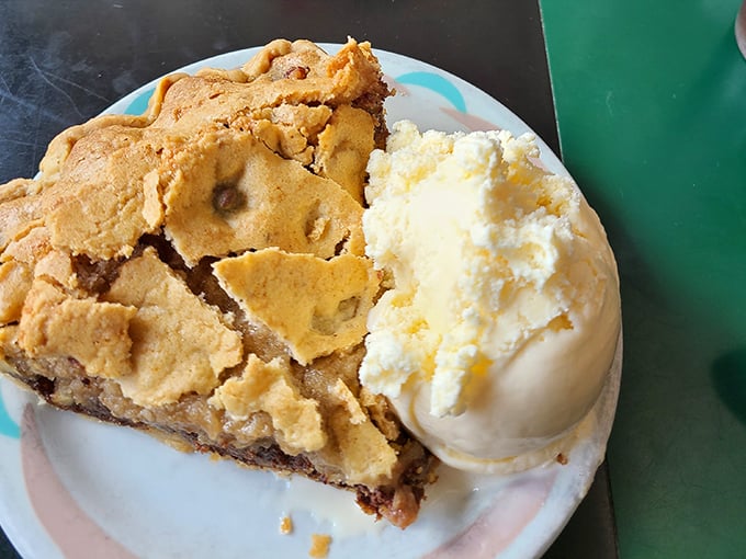Apple pie à la mode—where flaky crust meets creamy vanilla ice cream in a dessert romance that would make Norman Rockwell reach for his paintbrush.
