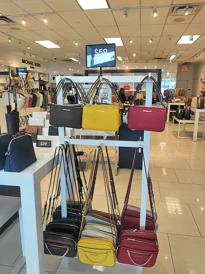 Michael Kors handbags displayed like colorful candy—suddenly that $50 in your pocket feels like it has magical powers. 