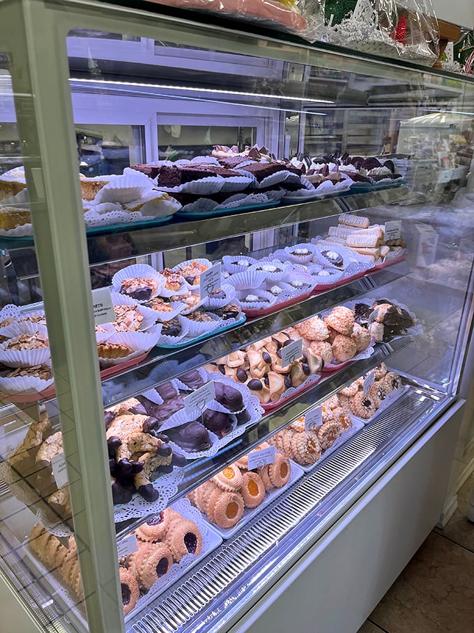 The display case – a museum of edible art where each pastry competes for your attention and your stomach votes on which masterpiece to enjoy first.