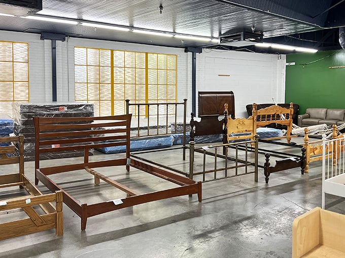 Bed frames that have seen dreams from different decades line up like architectural time travelers waiting for new adventures.