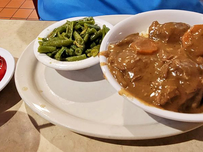 These beef tips and gravy could make a vegetarian question their life choices. The green beans aren't just a side—they're swimming in flavor all their own.