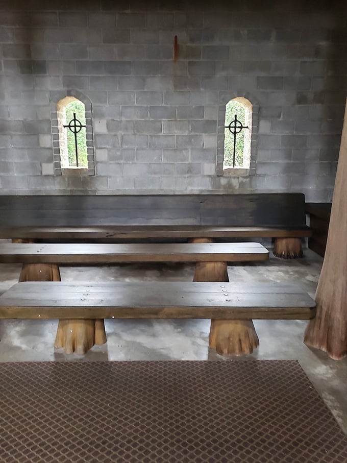 Simple wooden benches beneath arched windows create a monastic atmosphere where visitors can contemplate life's big questions—or just rest their feet.
