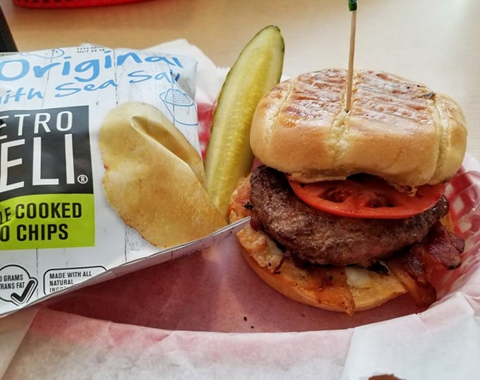 This burger doesn't just satisfy hunger—it conquers it. Nestled on a toasted bun with a pickle standing guard, it's the cavalry your appetite called for.