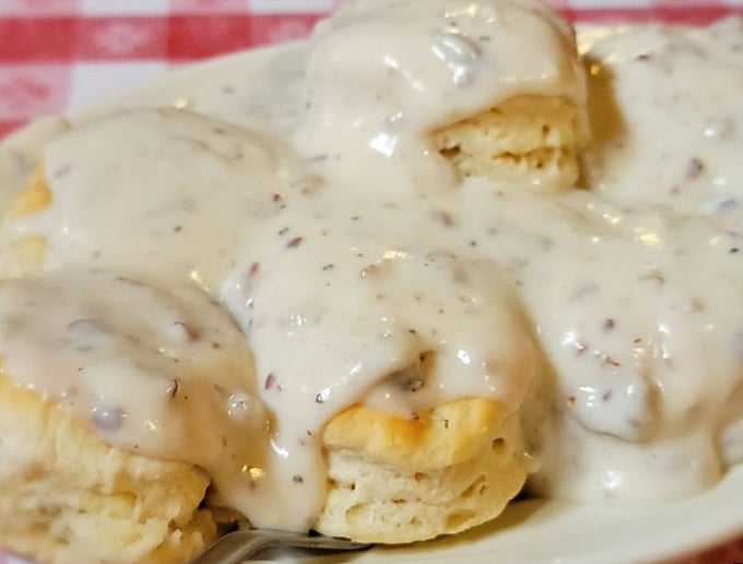Biscuits swimming in peppery cream gravy—the kind of breakfast that doesn't just start your day, it fuels a week of memories and a lifetime of cravings.