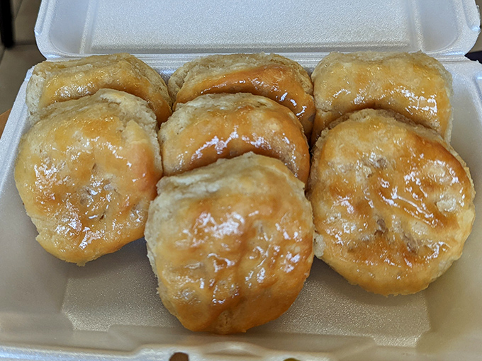 These aren't just biscuits—they're buttery clouds of Southern comfort, glistening with a honey glaze that makes resistance utterly futile.