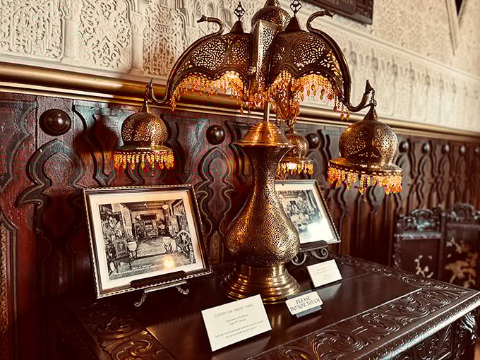 Not your average IKEA lamp! These intricate brass fixtures cast patterns across the walls that dance like Mediterranean sunlight through ancient latticework.