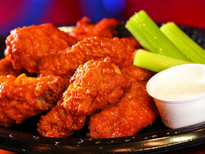 Buffalo wings that don't mess around—fiery, crisp, and accompanied by cooling celery and dip. A holy trinity of flavor that demands respect.