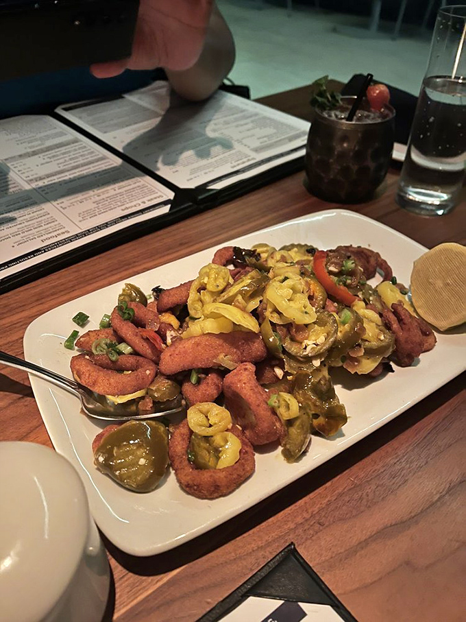 The famous cherry pepper calamari isn't just food—it's an intervention for people who think they don't like squid. Crispy, spicy seafood revelation.