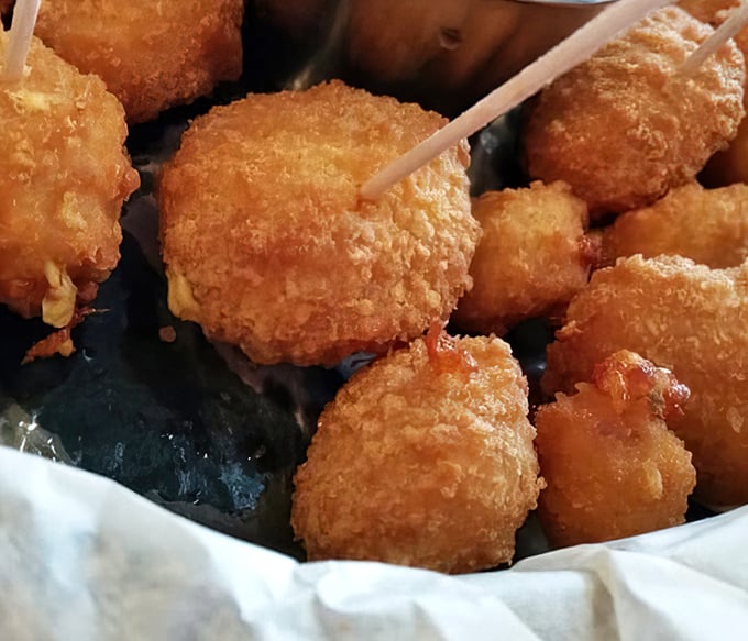 Golden-fried cheese curds that squeak with Wisconsin pride. The sound of happiness is that first bite—crunchy exterior giving way to molten cheese.