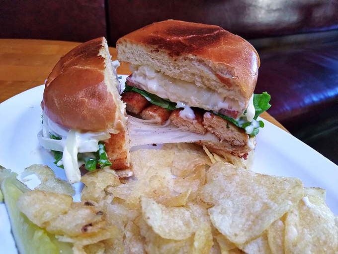 This sandwich isn't just stacked—it's architected. The crispy chips aren't a side; they're essential supporting characters in this lunch drama.