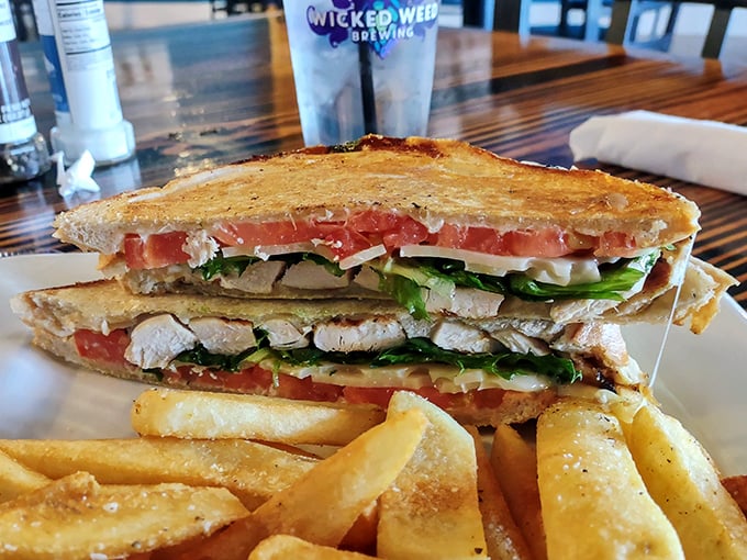 The chicken sandwich isn't just a sandwich – it's architecture with purpose. Layers of flavor stacked between golden bread with crispy fries standing guard.