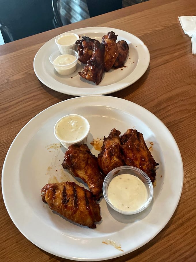 These aren't just wings; they're crispy, smoky flavor bombs that'll have you contemplating whether napkins are actually optional. (Spoiler: they're not.)