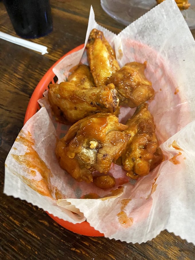 These wings aren't trying to fly—they're trying to make you forget every other wing you've ever had. Saucy, sticky perfection worth the napkin investment.