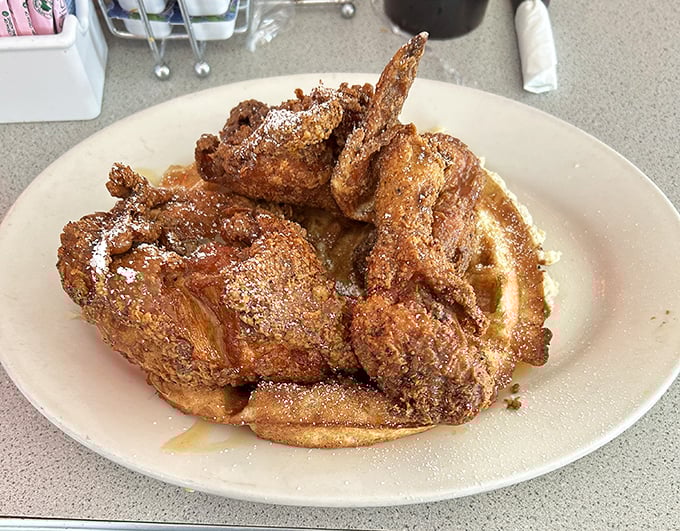 Fried chicken and waffles – the breakfast equivalent of a perfect marriage, where sweet meets savory in a union blessed by maple syrup.