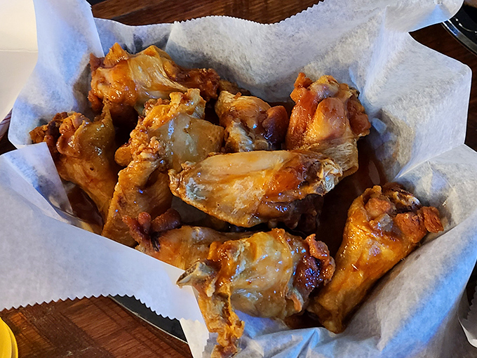 Wing perfection isn't just about sauce—it's about that perfect crispy-yet-juicy balance. These golden beauties aren't just food; they're a religious experience with napkins.