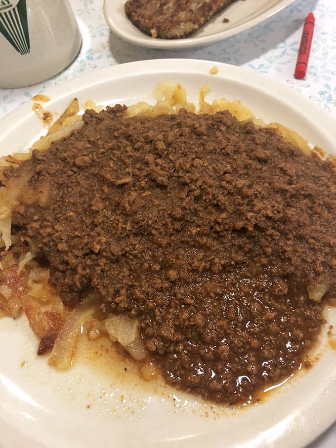 Cincinnati chili over hash browns—a carb-loaded canvas for that signature spice blend. Comfort food engineering at its finest.