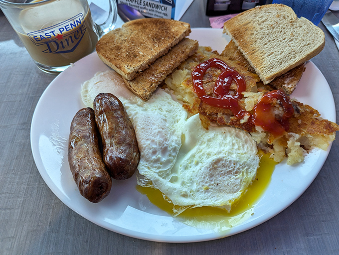 Breakfast perfection doesn't exi— wait, it does. Sunny-side eggs, sausage links, and hash browns with that ideal crispy-to-fluffy ratio that would make your grandmother proud.
