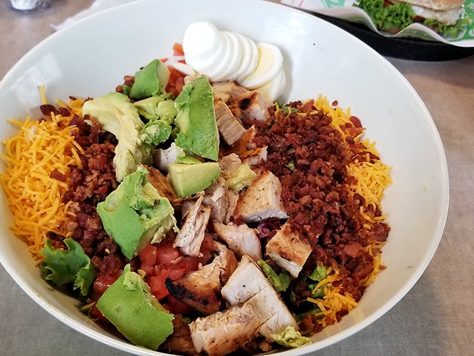 This isn't just a salad – it's a protein-packed flavor festival with grilled chicken, bacon, avocado, and cheese that makes eating healthy feel like cheating.