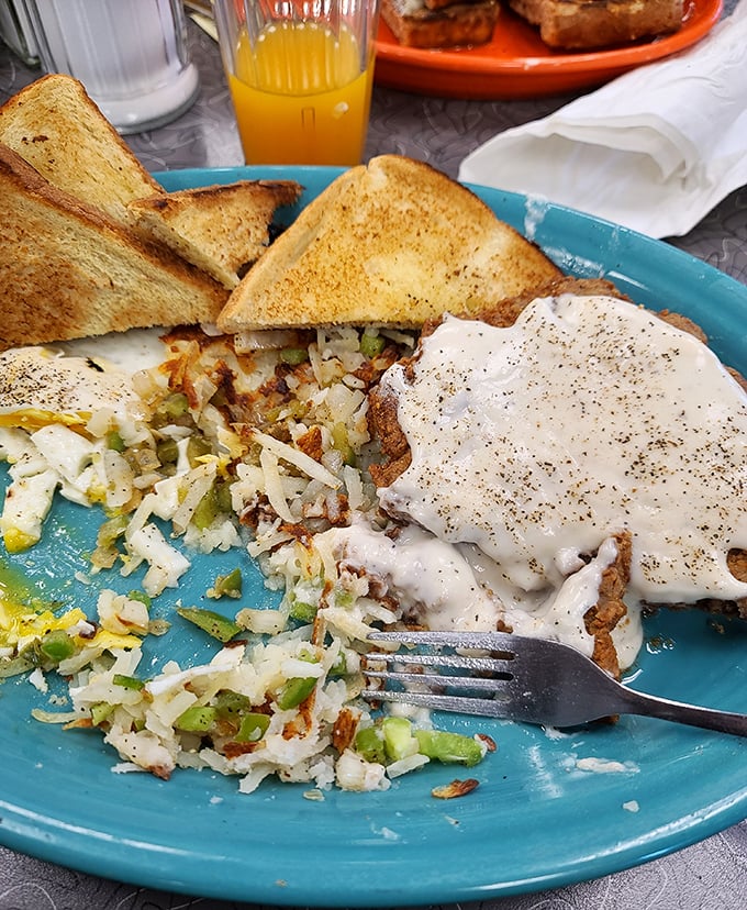 Country fried potatoes mingling with perfectly seasoned eggs and toast—a breakfast trinity that would make even non-morning people set an alarm.