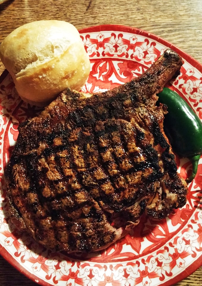 This cowboy ribeye isn't just dinner – it's an event. The grill marks tell stories of mesquite smoke and patient expertise.