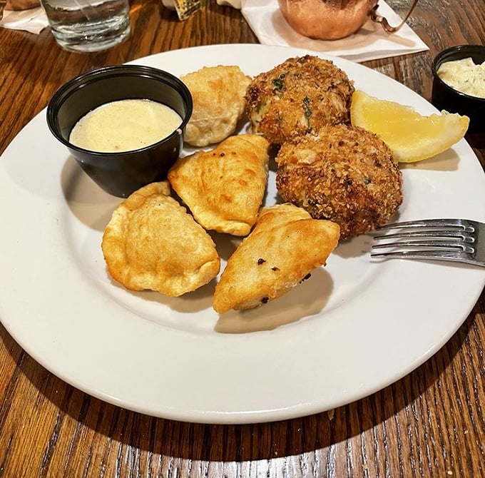 Golden-brown crab cakes that are mostly crab (not filler) paired with savory lobster pie—a seafood lover's dream team.