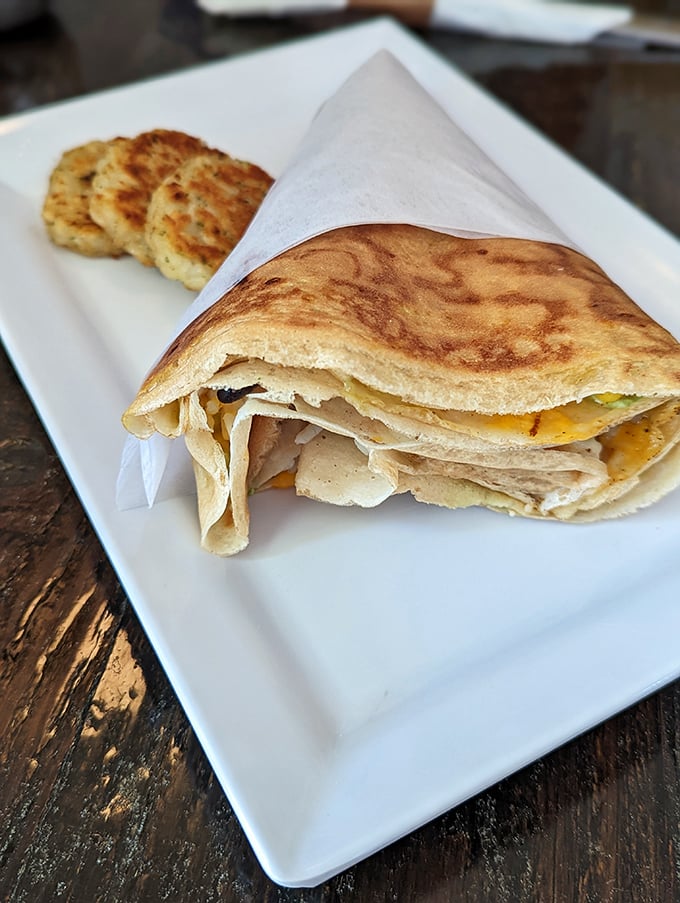 Golden, paper-thin perfection wrapped around savory fillings. Those potato cakes on the side aren't just accessories—they're scene-stealers.