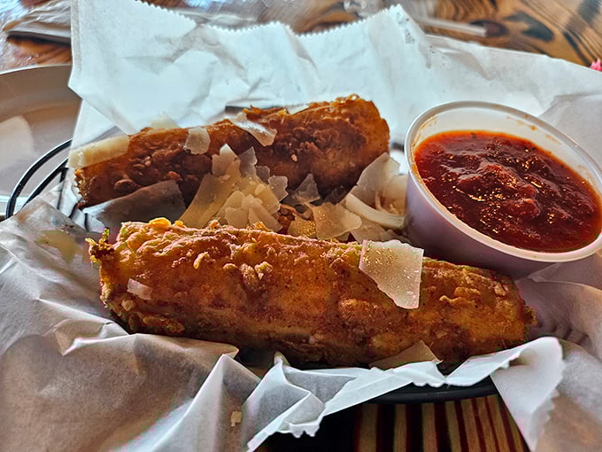 Crispy, golden-brown perfection with a side of tangy sauce—these morsels might make you temporarily forget you came for steak.