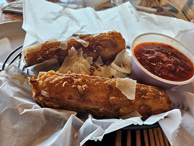 Crispy, golden-brown perfection with a side of tangy sauce—these morsels might make you temporarily forget you came for steak.