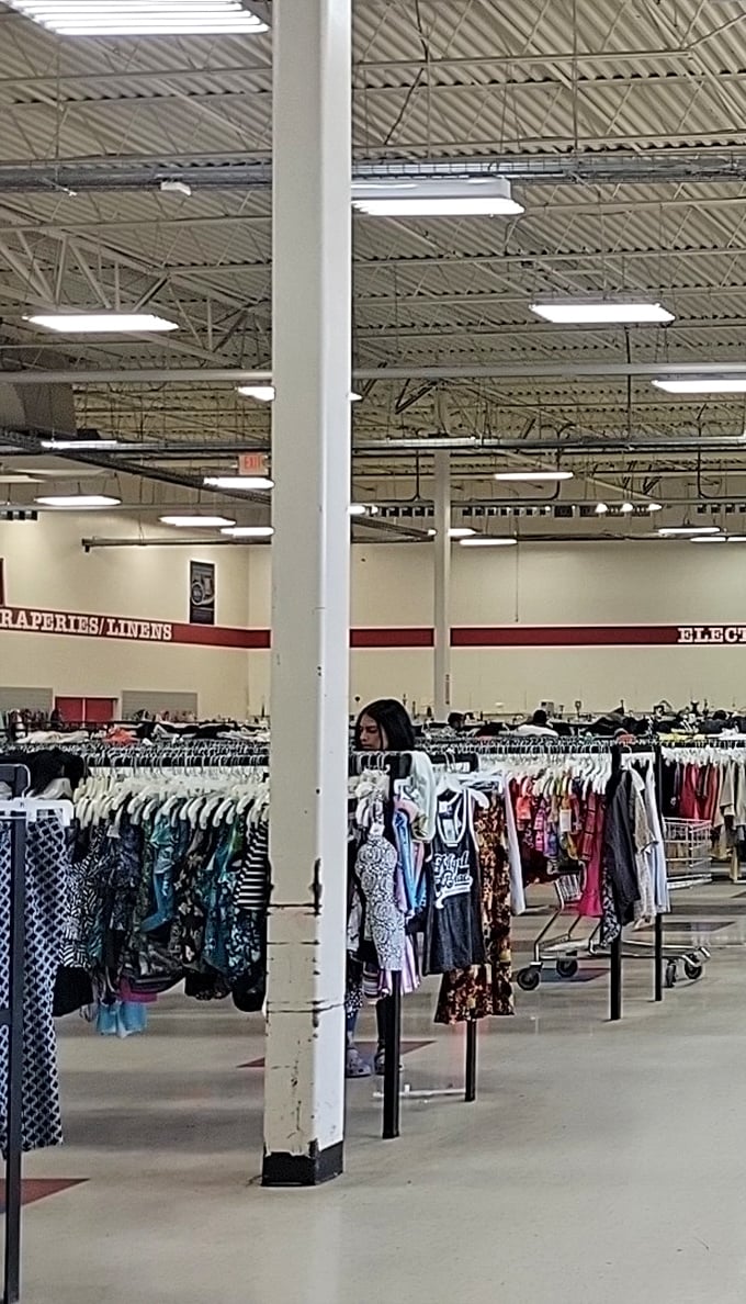 The high ceilings and industrial expanse reveal the true scale of this operation—less "store" and more "secondhand stadium."