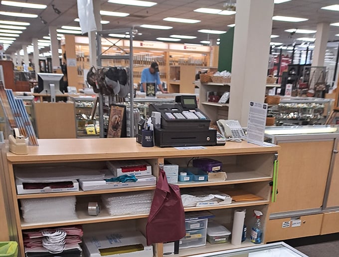 The checkout area stands ready to process your haul of kitchen treasures and outdoor gear finds.