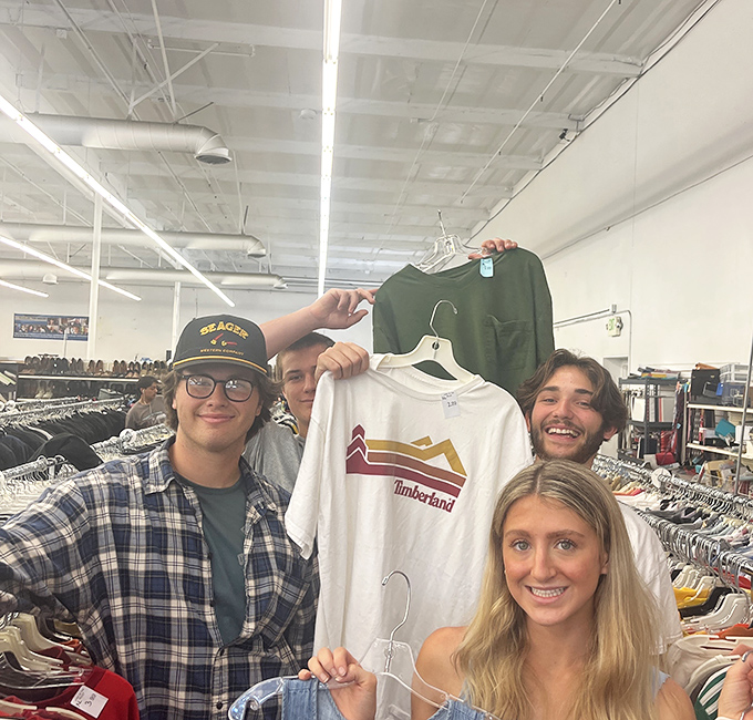 Young treasure hunters celebrate their finds, proving thrifting isn't just a hobby—it's a social experience that crosses generational divides.