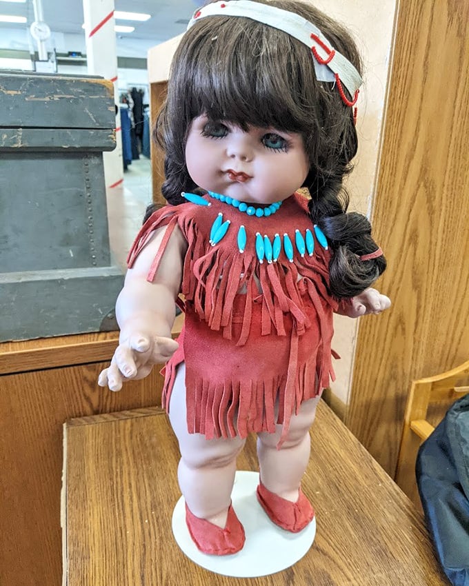 This Native American-styled doll isn't just vintage kitsch—it's someone's childhood memory waiting for its second act in a new home's display cabinet.