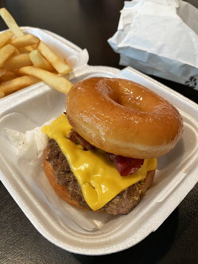 The donut burger laughs in the face of convention, using glazed sweetness instead of a bun. It's breakfast and lunch having a delicious identity crisis.