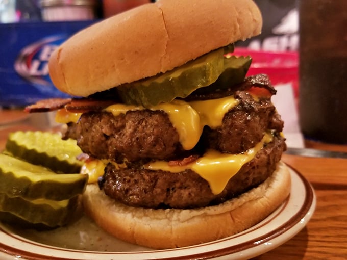 Behold the double bacon cheeseburger in all its glory—a towering monument to beef that would make even the most dedicated cardiologist weak at the knees.