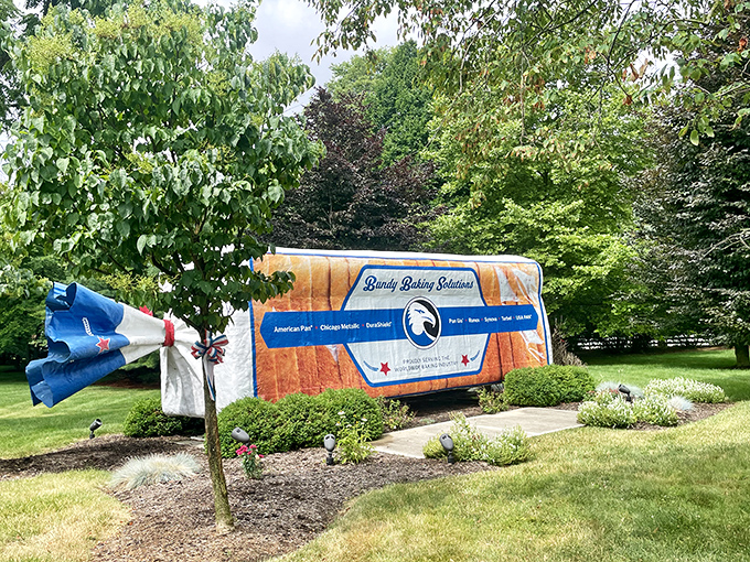 Not your average garden feature. The meticulous landscaping around this carb colossus creates a surreal juxtaposition that would make Salvador Dalí reach for a butter knife.