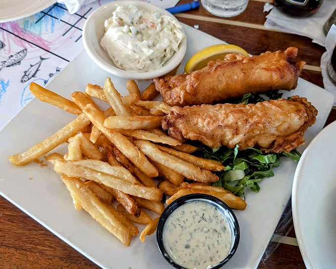 Fish and chips that would make a British pub jealous. Golden-battered perfection meets hand-cut fries in a plate that whispers, "Diet? What diet?"