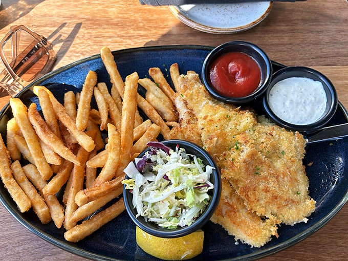 Fish and chips elevated from humble pub fare to coastal artwork. The perfect crunch gives way to flaky white fish that tastes like it jumped straight from ocean to plate.