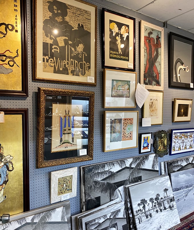 The blue pegboard gallery wall showcases vintage advertising posters that Don Draper would've created – or collected after a three-martini lunch.