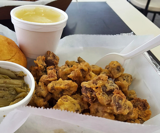Gizzards and greens—the kind of Southern plate that makes you wonder why we ever bothered inventing molecular gastronomy when perfection was already achieved. 