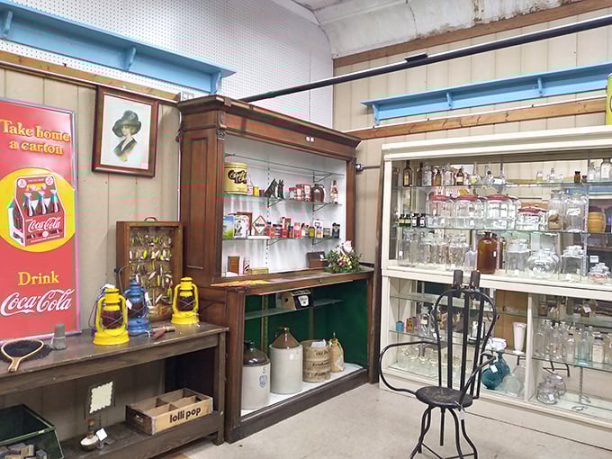 A Coca-Cola collector's dream corner where vintage advertising meets practical glassware – proof that marketing was an art form before digital existed.