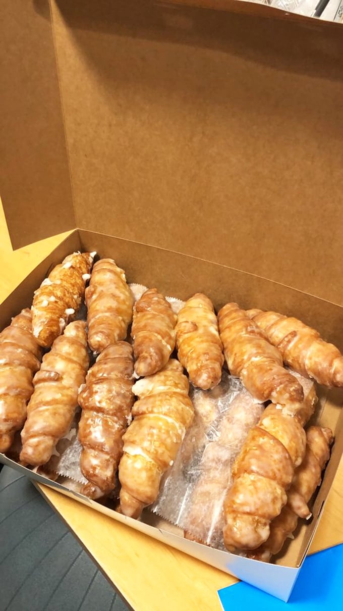 Golden croissants lined up like delicious soldiers, each one a buttery testament to why alarm clocks were invented in the first place.