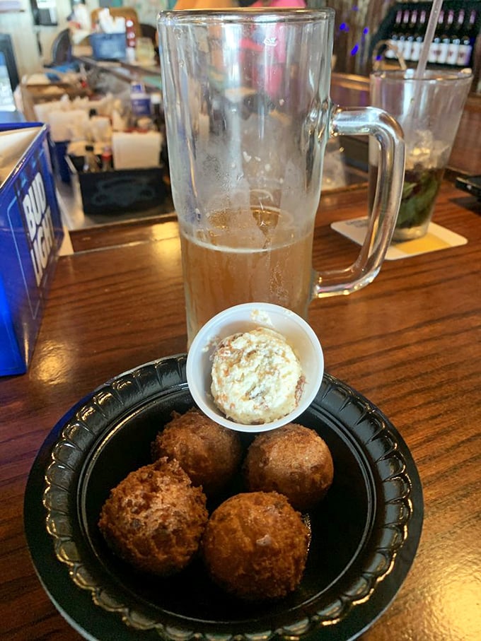 Hush puppies and cold beer—a combination so perfect it should have its own national holiday and commemorative postage stamp.