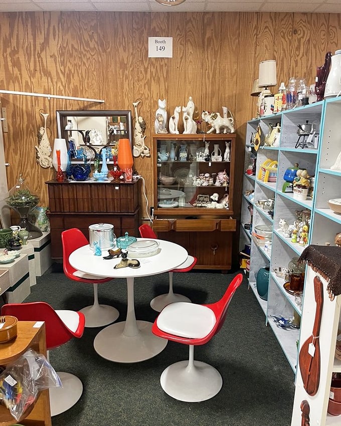 Booth 149 is a mid-century modern paradise. Those tulip chairs aren't just furniture—they're time machines to 1962.