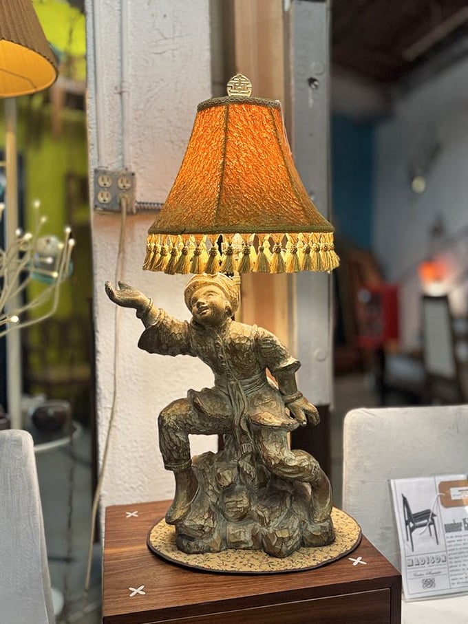 Not just a lamp but a conversation piece. This gilded figure seems to say, "Yes, I'm quirky, and I'll be the most interesting thing in your living room."