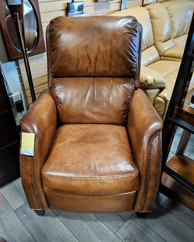 This leather recliner has stories to tell. With its worn-in comfort and classic style, it's ready for its second act in someone's living room.