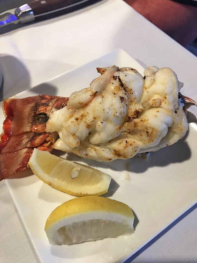Lobster tail that's had exactly the right kind of day at the spa – butter-bathed, perfectly seasoned, and ready for its close-up.