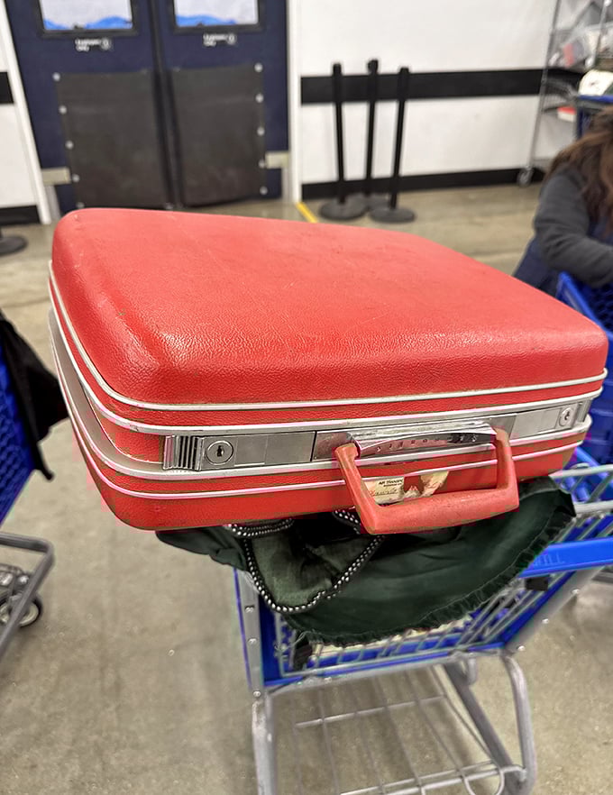 This vintage red suitcase isn't just luggage—it's a time capsule waiting for its second act in someone's Instagram-worthy home décor.
