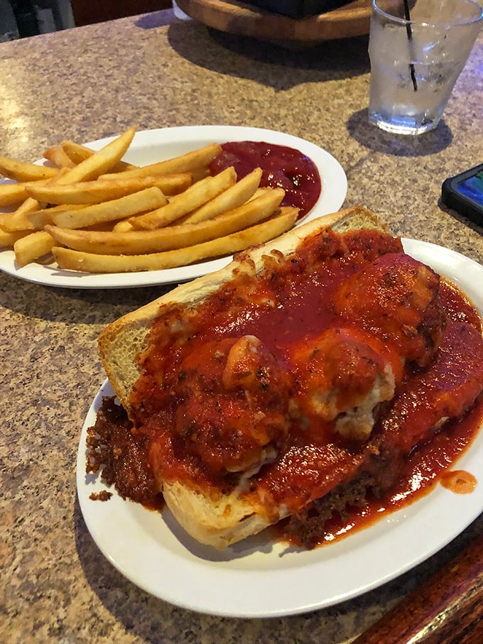 The open-faced meatball sandwich doesn't just satisfy hunger—it obliterates it. Homemade meatballs swimming in marinara that would make any Italian grandmother nod approvingly.
